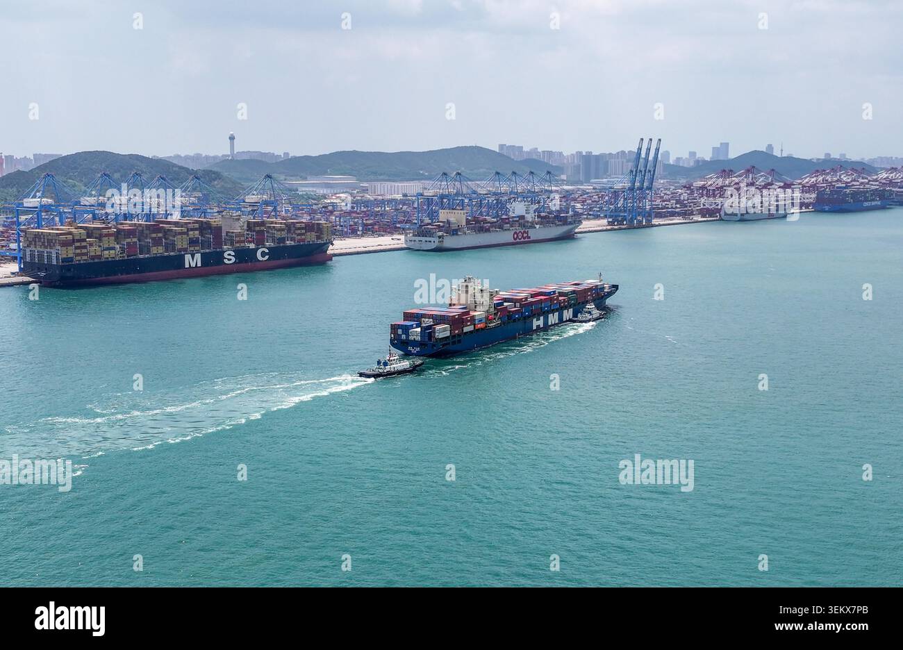 Large container ships loaded with foreign trade goods arrive at or ...