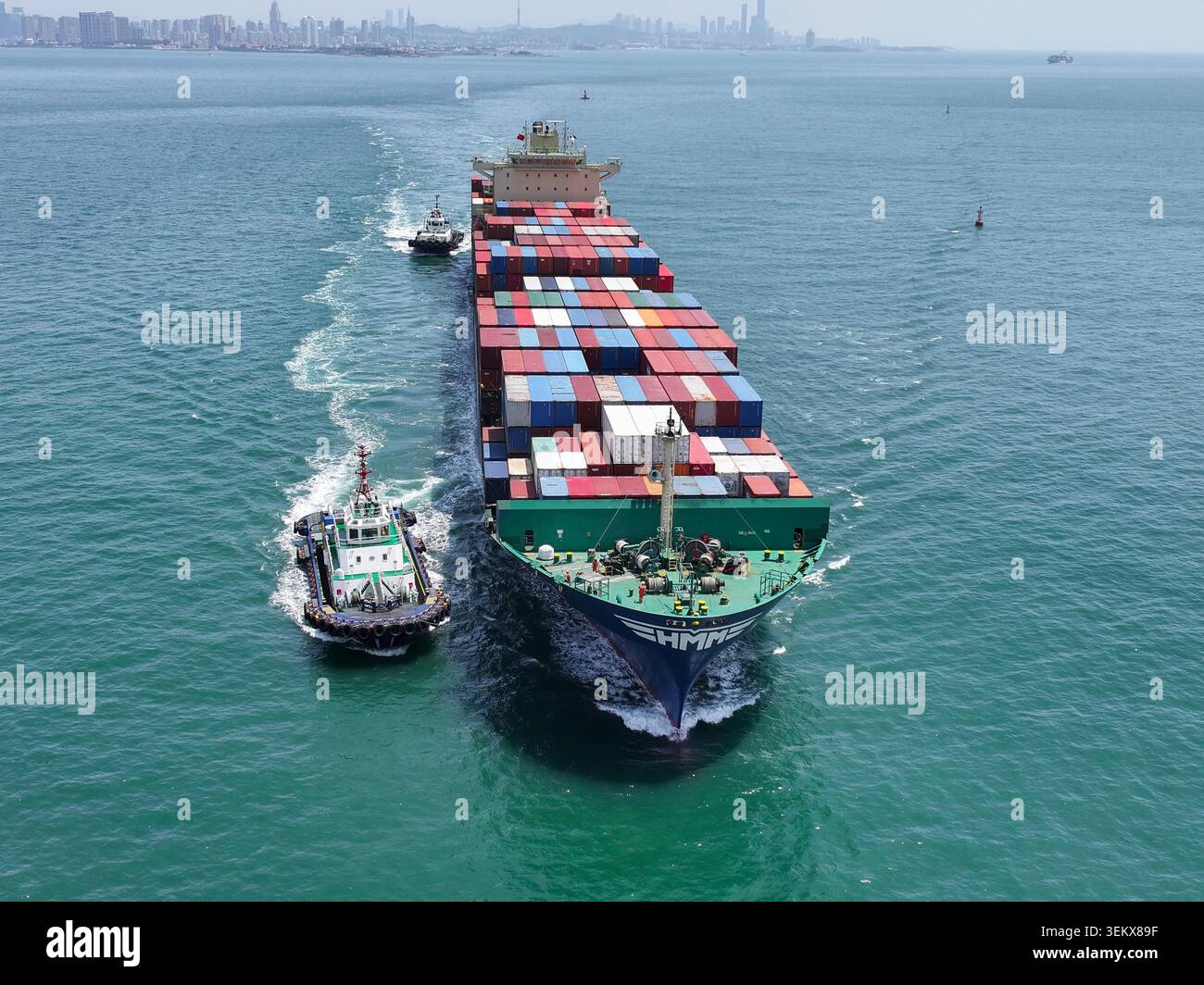 Large container ships loaded with foreign trade goods arrive at or ...