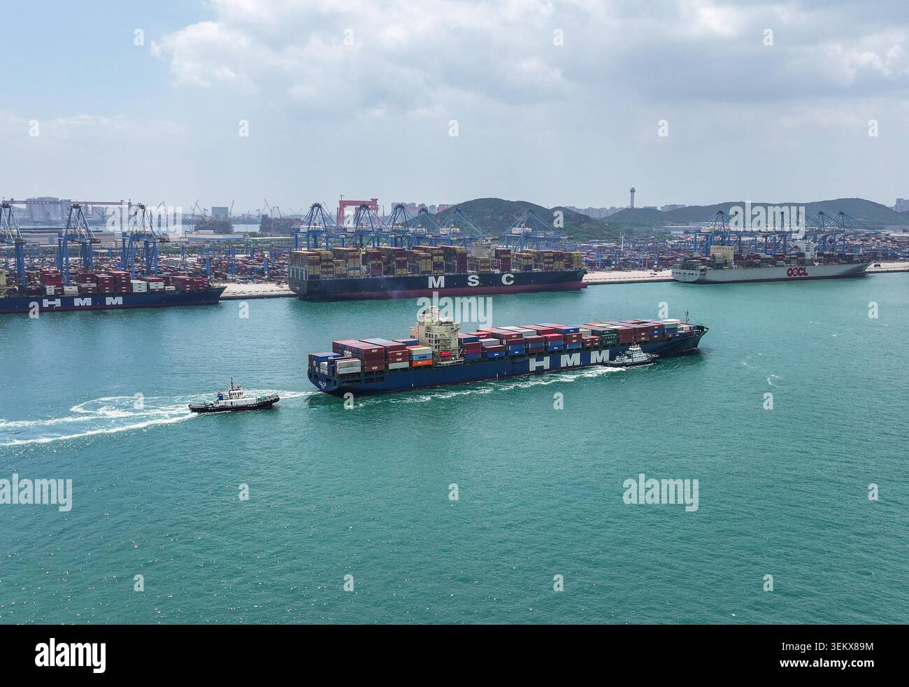 Large container ships loaded with foreign trade goods arrive at or ...