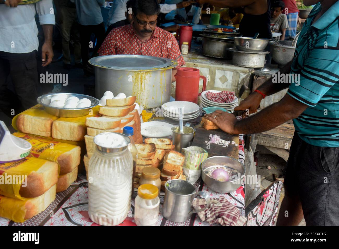 A vendor prepares food at a roadside stall in Kolkata, India, on June 3 ...