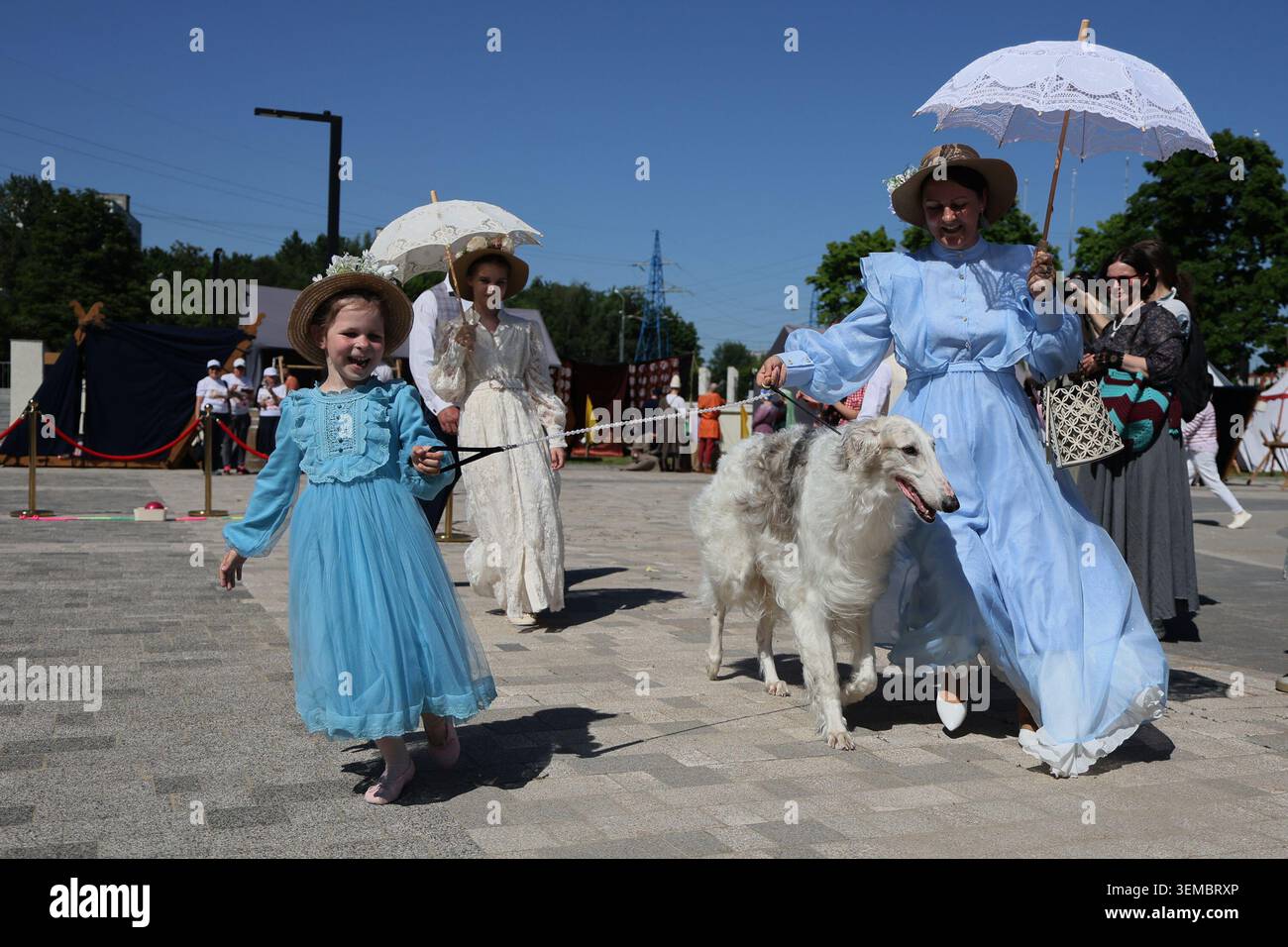 Contestants dressed in 19th-century clothing stand with their Borzoi ...