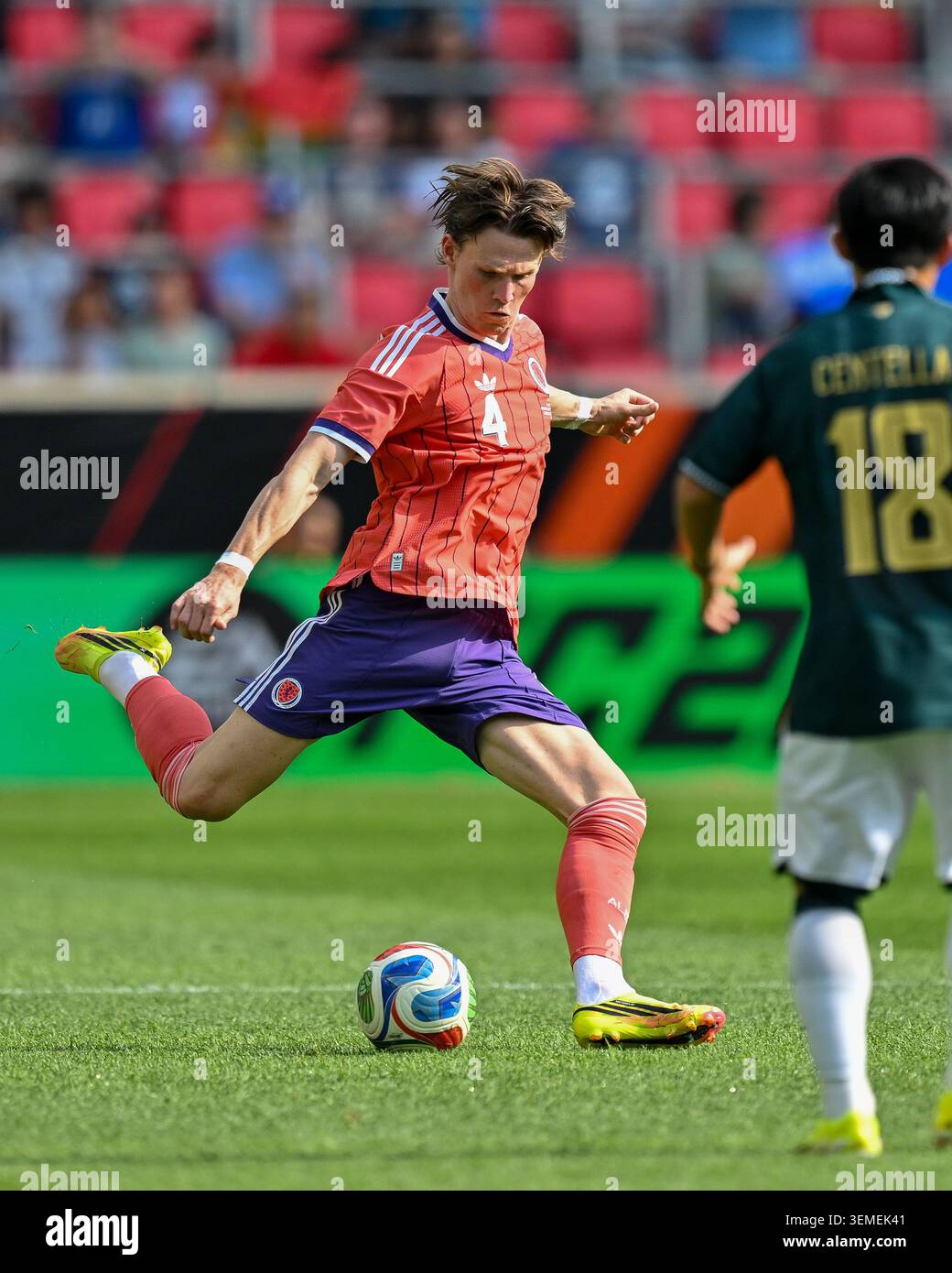 Scott McTominay (4) of Scotland strikes the ball during an ...