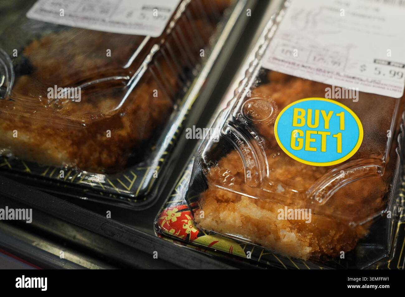 FILE - "Buy one Get one" sign is displayed on a product at a grocery ...