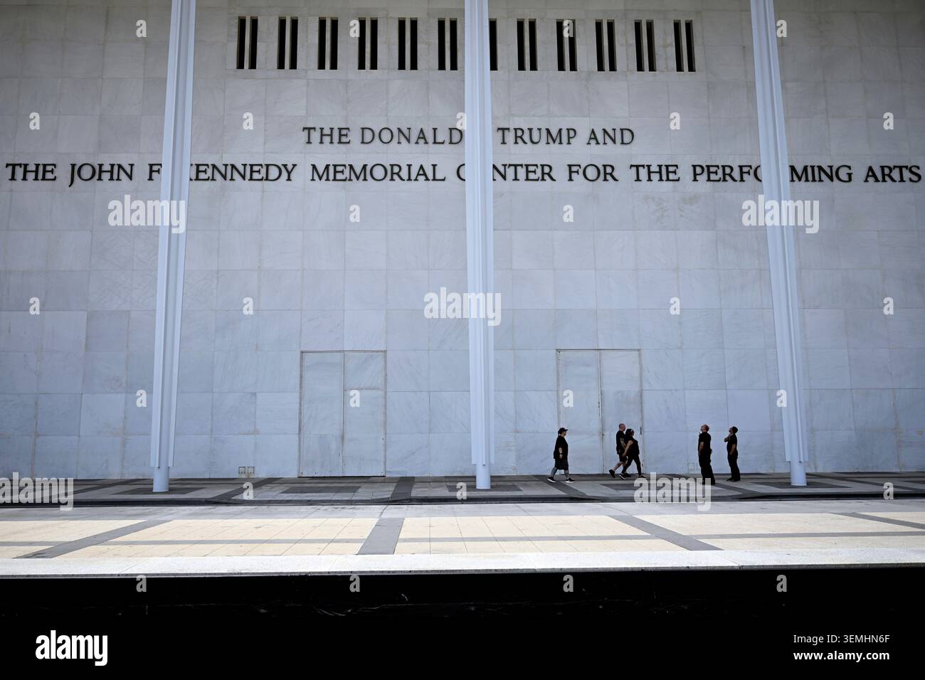 People walk under the sign at The John. F. Kennedy Center for the ...