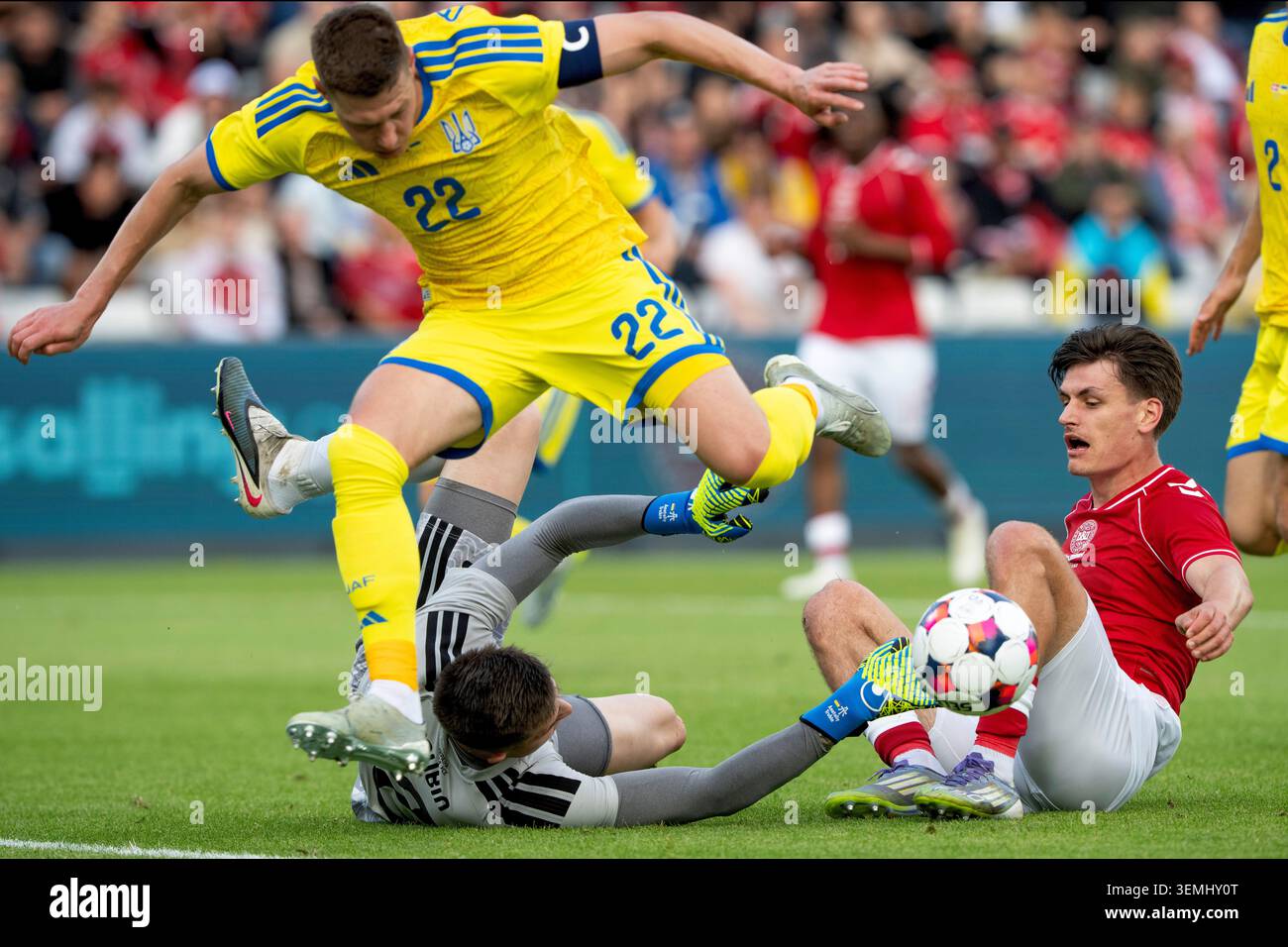 Denmark's Joakim Maehle in action with Ukraine's goalkeeper Anatoliy ...