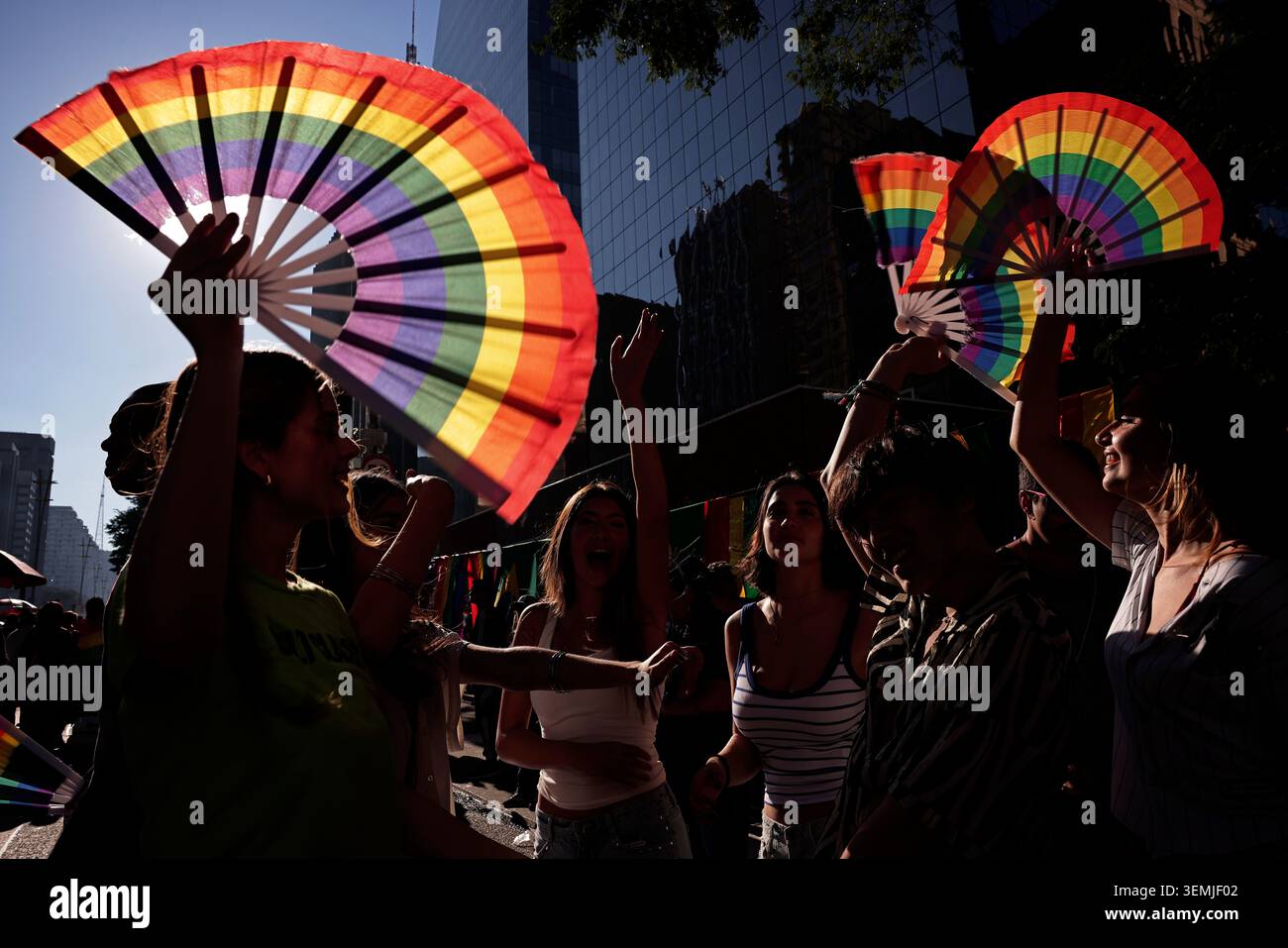 Revelers wave rainbow fans during the annual Pride Parade in Sao Paulo ...