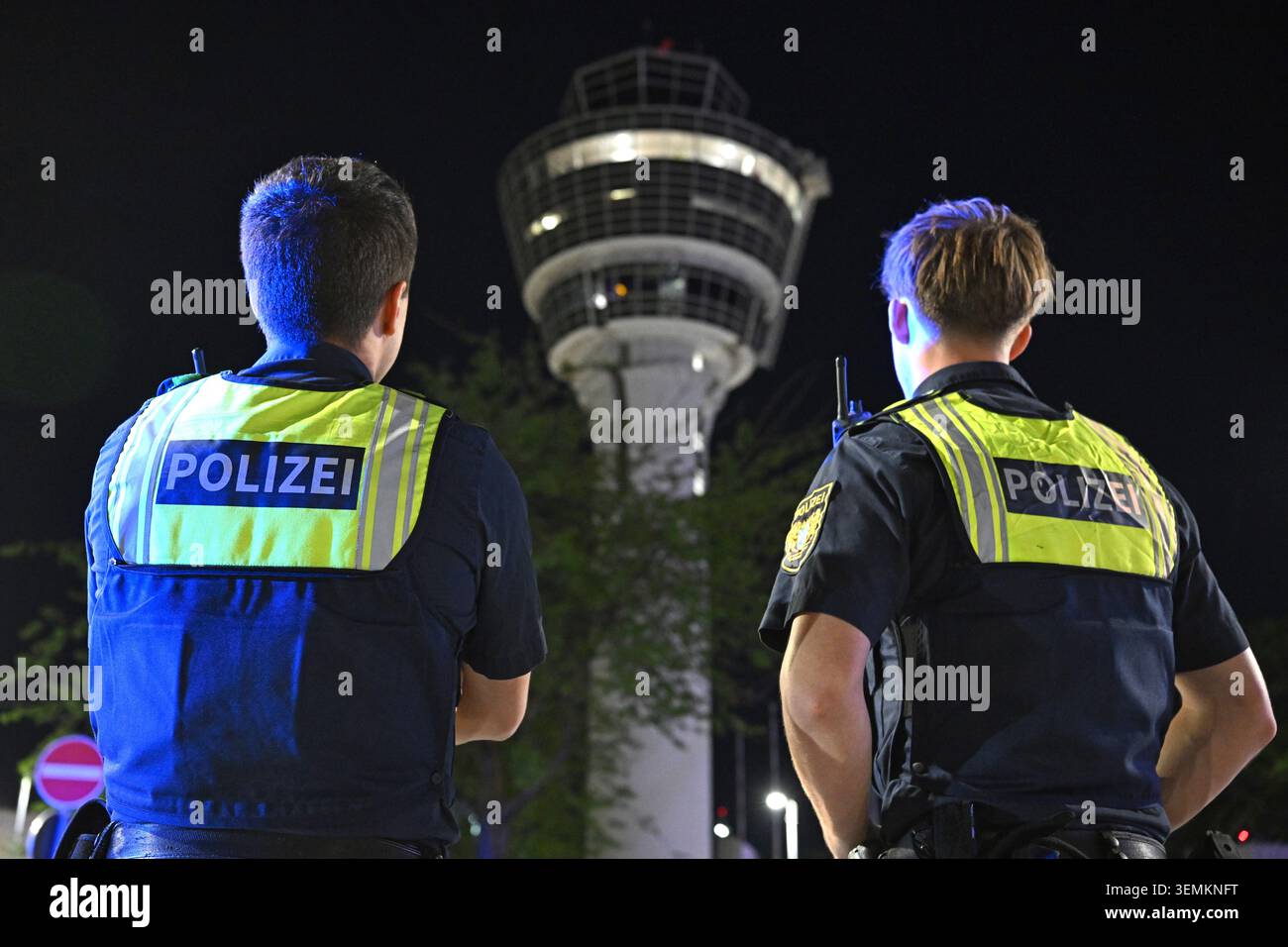 07 June 2026, Bavaria, Munich: Two police officers stand in front of ...