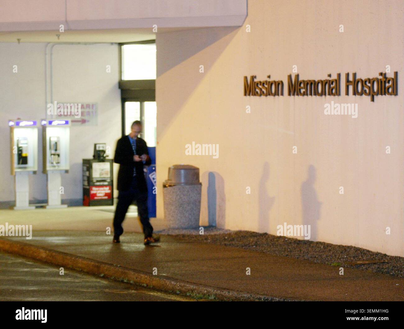 A man walks past the front doors of Mission Memorial Hospital in ...