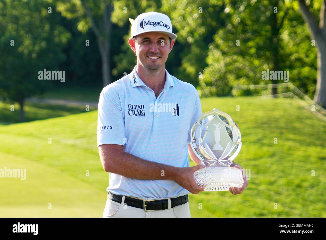 J.T. Poston poses with the trophy after winning the Memorial golf ...