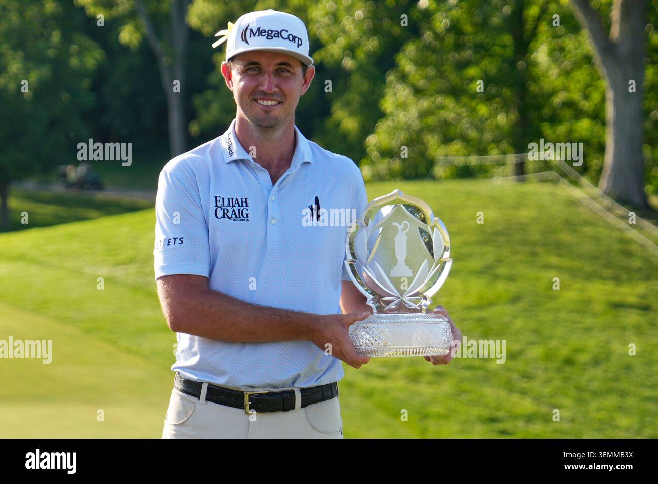 J.T. Poston poses with the trophy after winning the Memorial golf ...