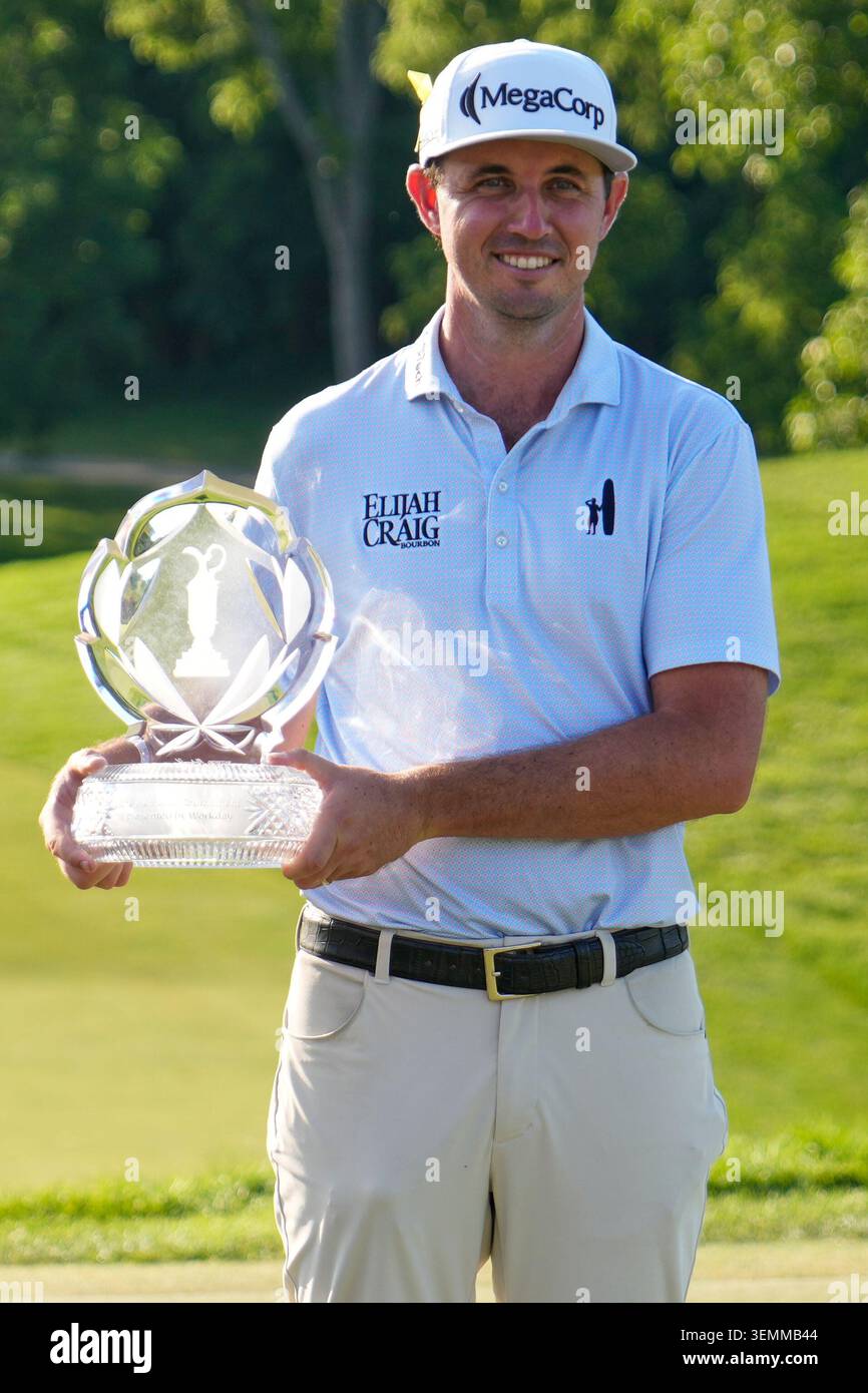 J.T. Poston poses with the trophy after winning the Memorial golf ...