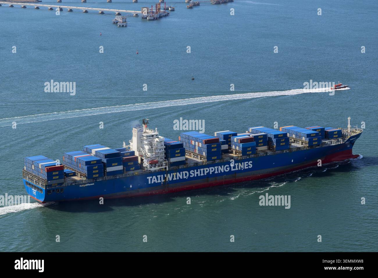 A container ship loaded with containers departs from the Qianwan ...