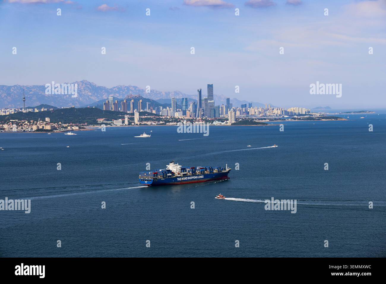 A container ship loaded with containers departs from the Qianwan ...