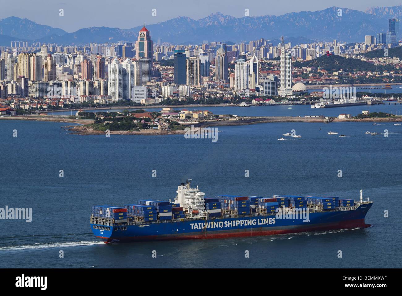 A container ship loaded with containers departs from the Qianwan ...