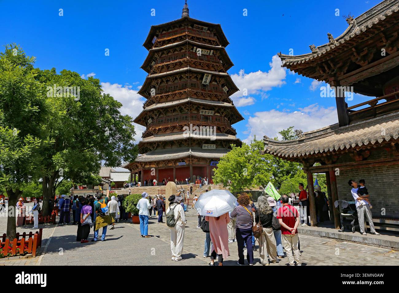 Tourists visit the Yingxian Wooden Pagoda, a 67.31-meter-tall pure ...