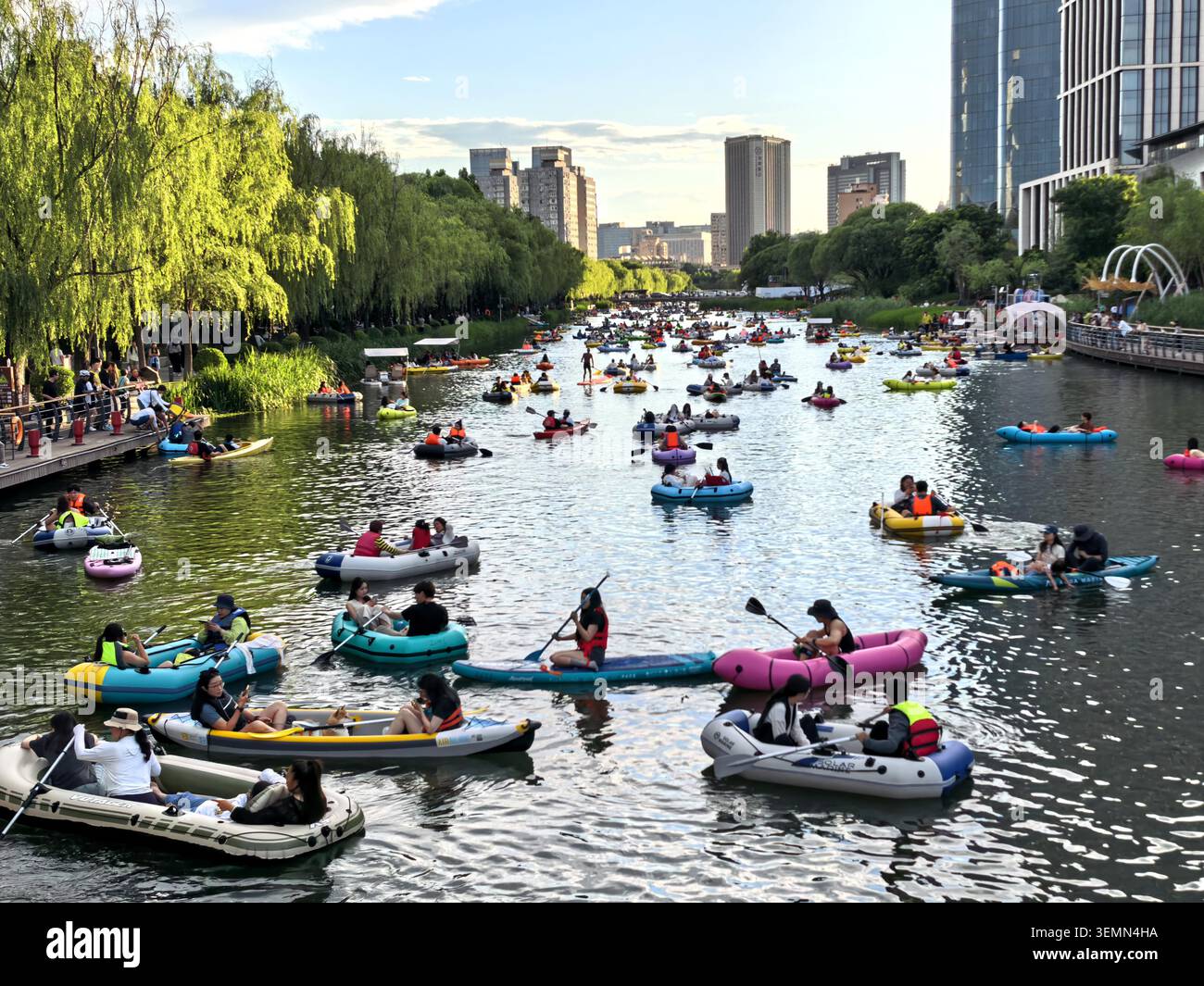 People take boat rides to enjoy the scenery and take photos along the ...