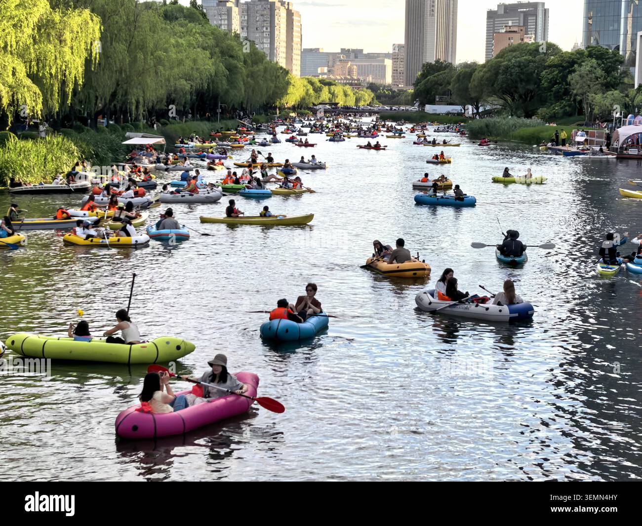 People take boat rides to enjoy the scenery and take photos along the ...