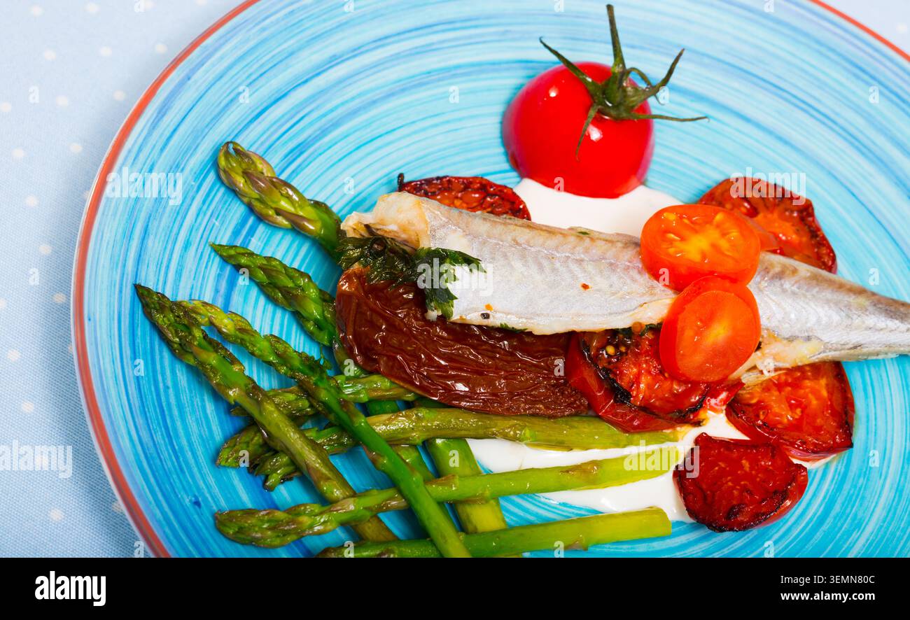 Baked whiting with sun-dried tomatoes, sparrowgrass, garlic creamy ...
