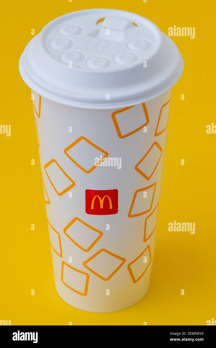 McDonalds paper drink cup with lid on yellow background, fast food ...