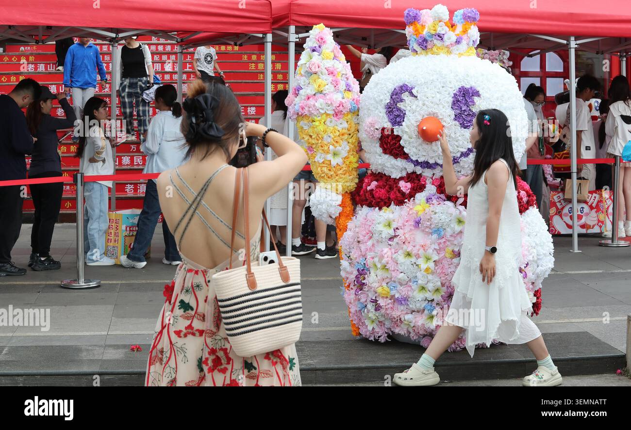 Customers visit Mixue Ice Cream & Tea's flagship store in Kunming ...