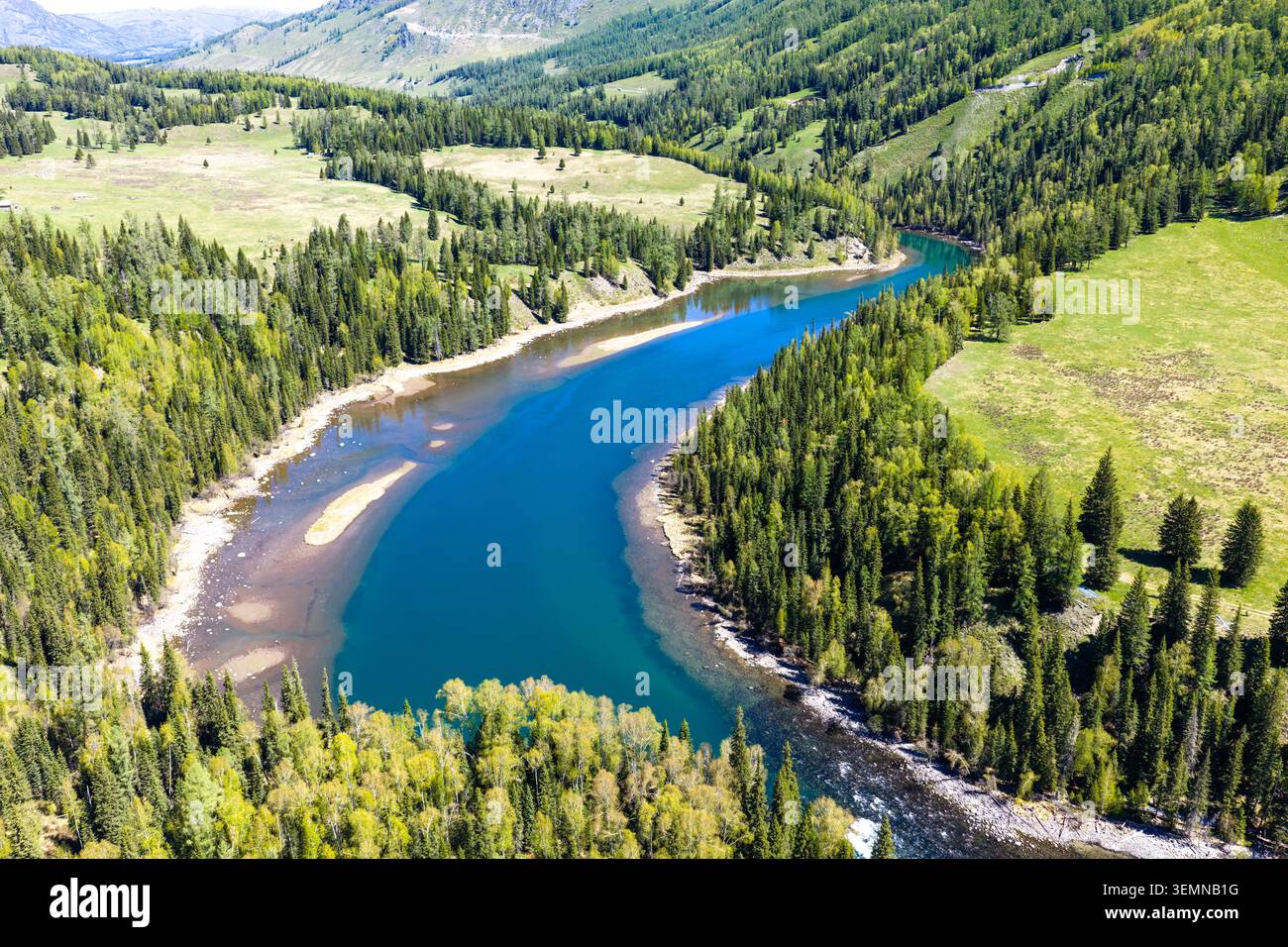 The Kanas River meanders through the valley at Kanas Moon Bay ...