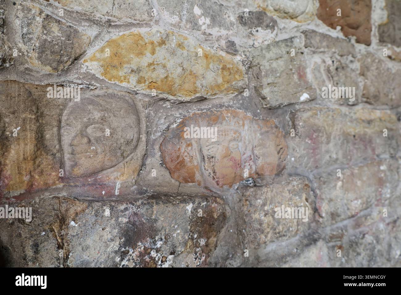 Carved stone faces and symbols in St Nicholas of Bari church in the old ...