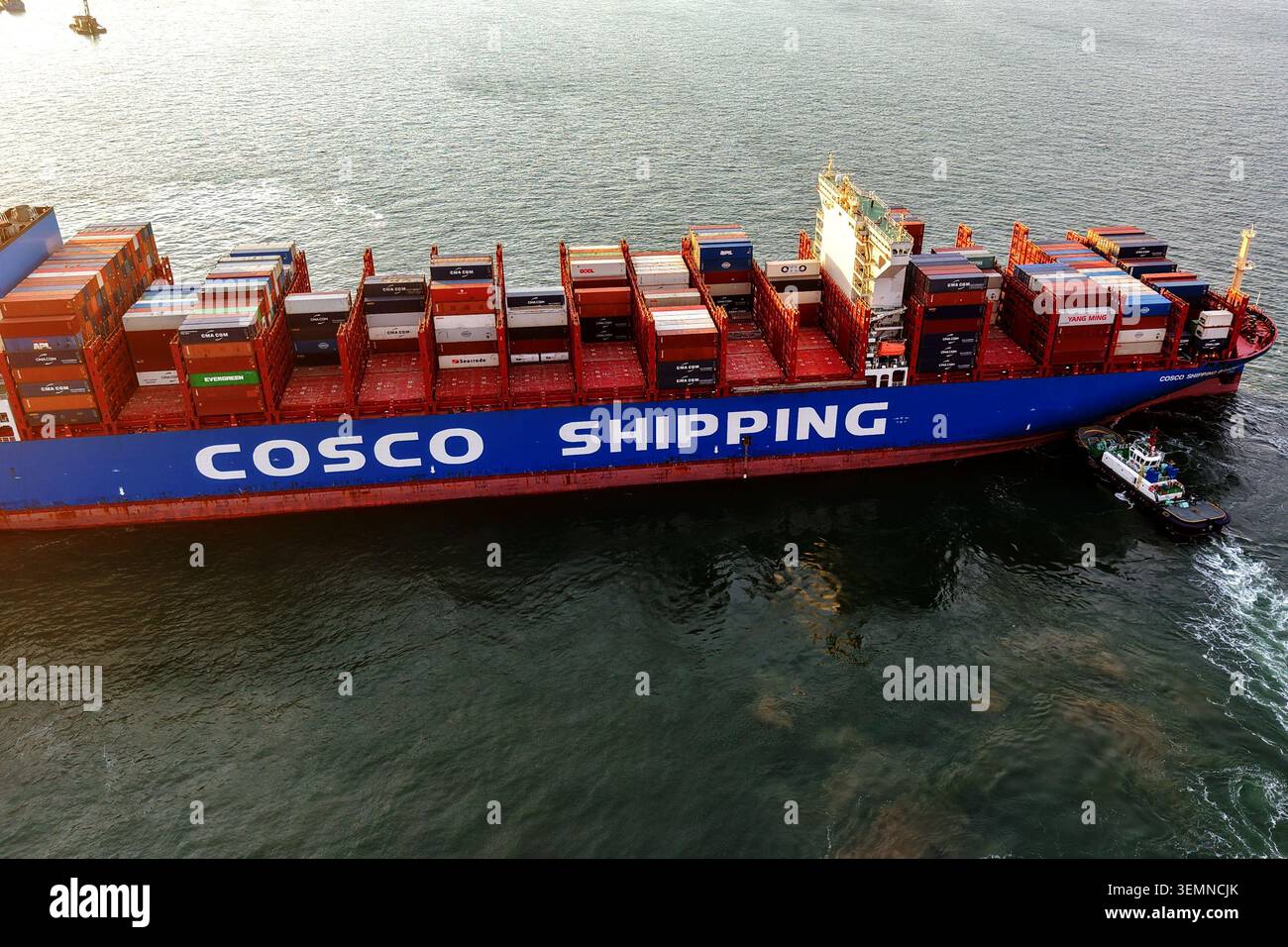 A cargo ship loaded with foreign trade containers departs from berth at ...