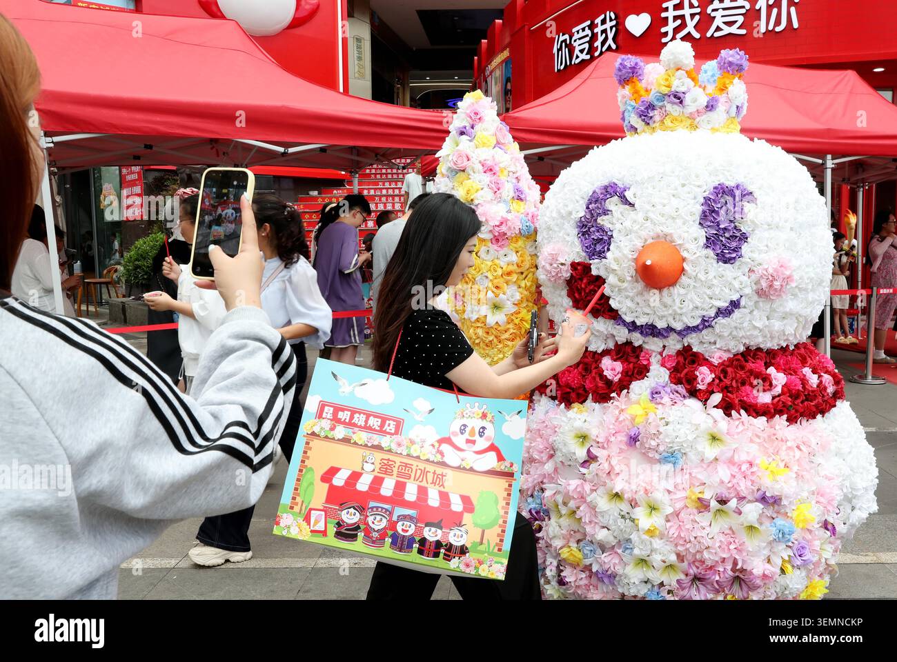 Customers visit Mixue Ice Cream & Tea's flagship store in Kunming ...