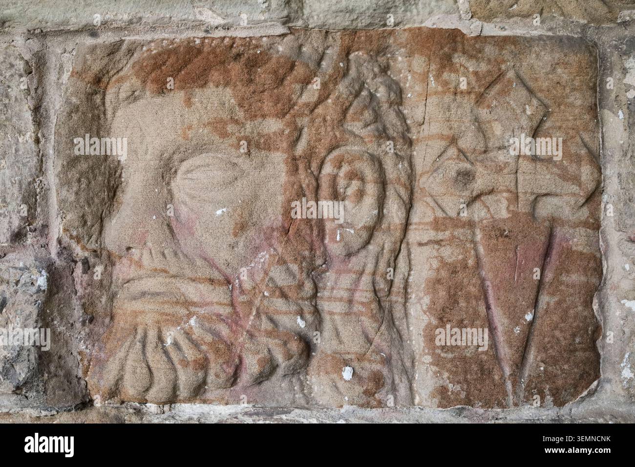 Carved stone faces and symbols in St Nicholas of Bari church in the old ...