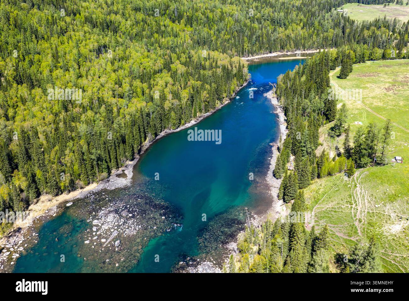 The Kanas River meanders through the valley at Kanas Moon Bay ...