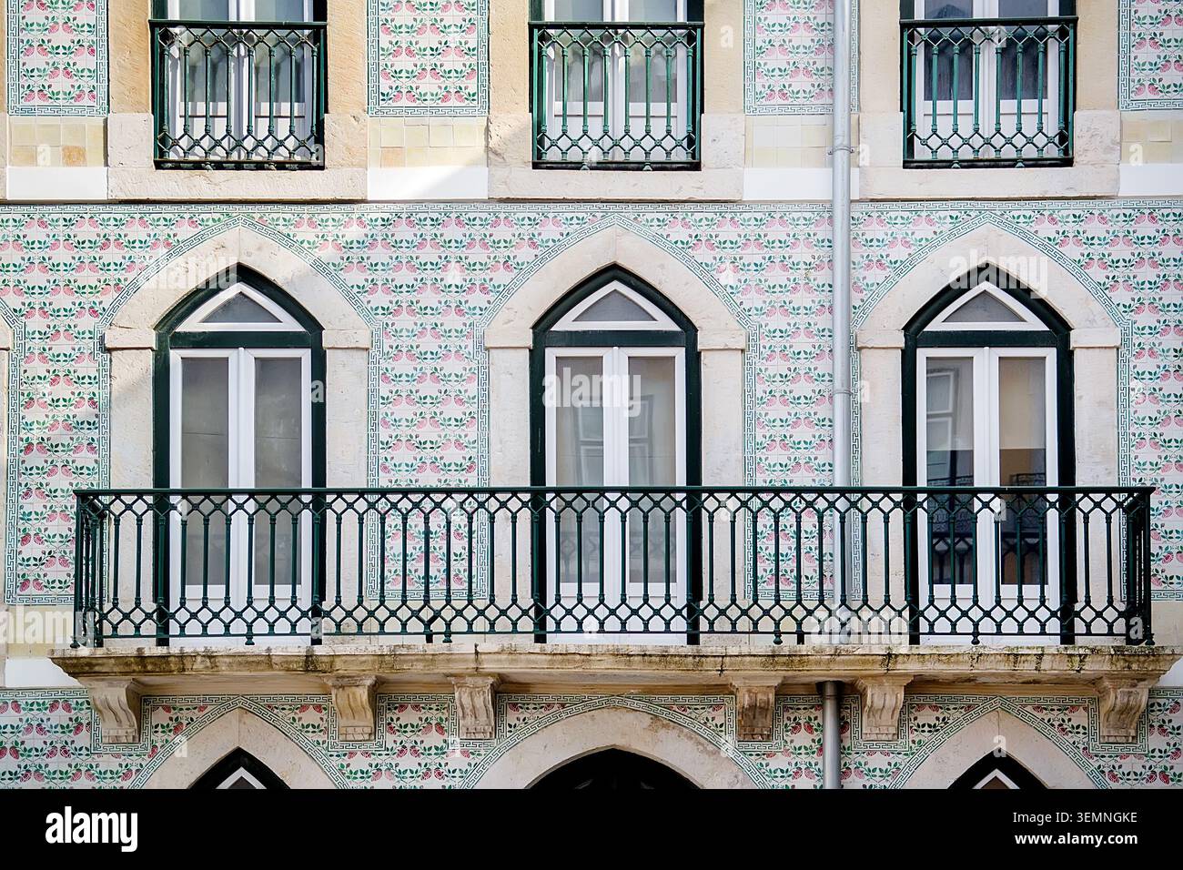 Lisbon windows with typical portuguese tiles on the wall. Selective ...