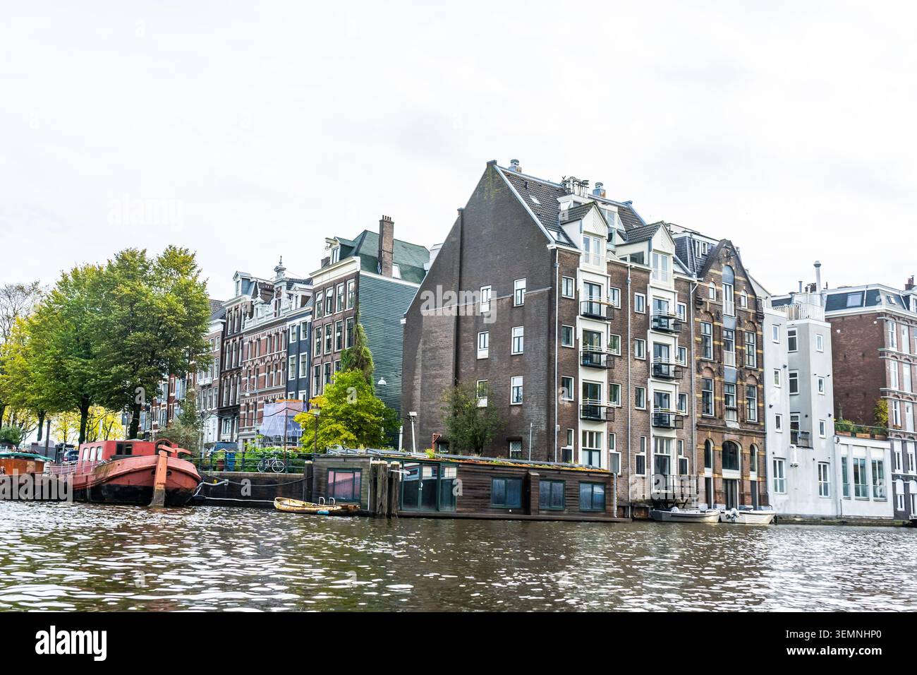 Amsterdam water Canal with Houseboat and Traditional Buildings. City ...