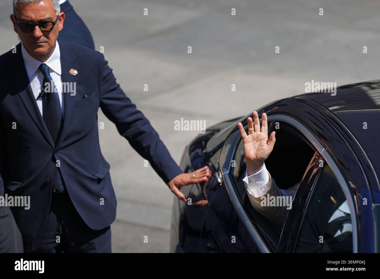 Pope Leo XIV waves as he exits the Spanish parliament in Madrid, Spain ...