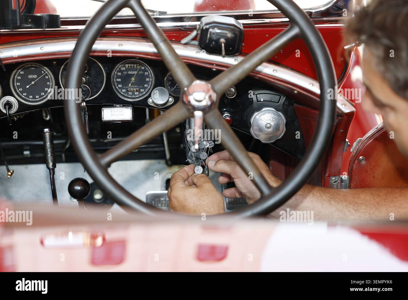 IPA85479996 - A detail of a vintage car during punching of 1000 Miglia ...