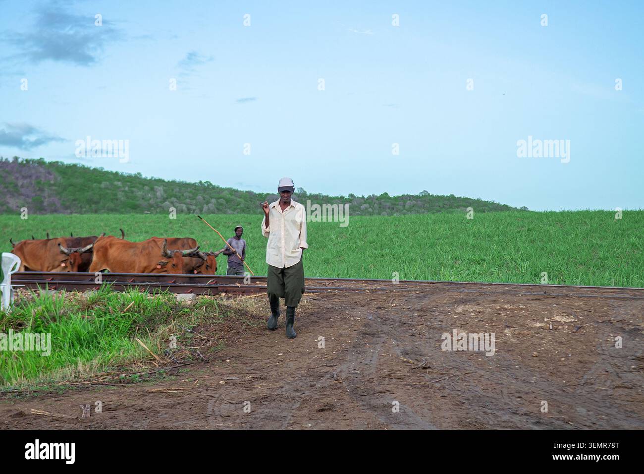 Dominican Republic, La Romana - 08 Jun 2021: Two men in hats and boots ...