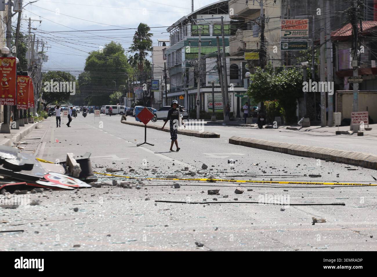 Debris lies on a road after an earthquake in General Santos ...