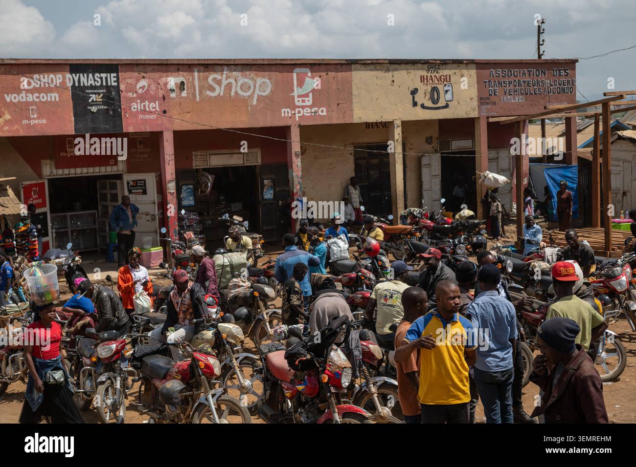 Motorcycle taxi riders wait to transport passengers in Bunia, Congo ...