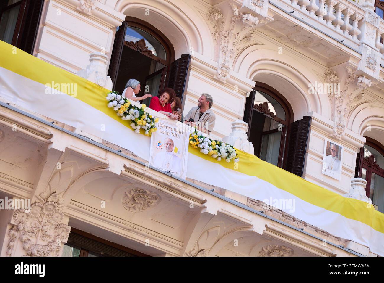 Pope Leo XIV waves to supporters as his motorcade passes through Madrid ...