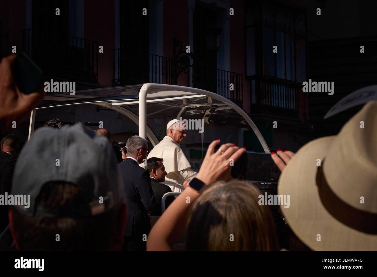 Pope Leo XIV waves to supporters as his motorcade passes through Madrid ...