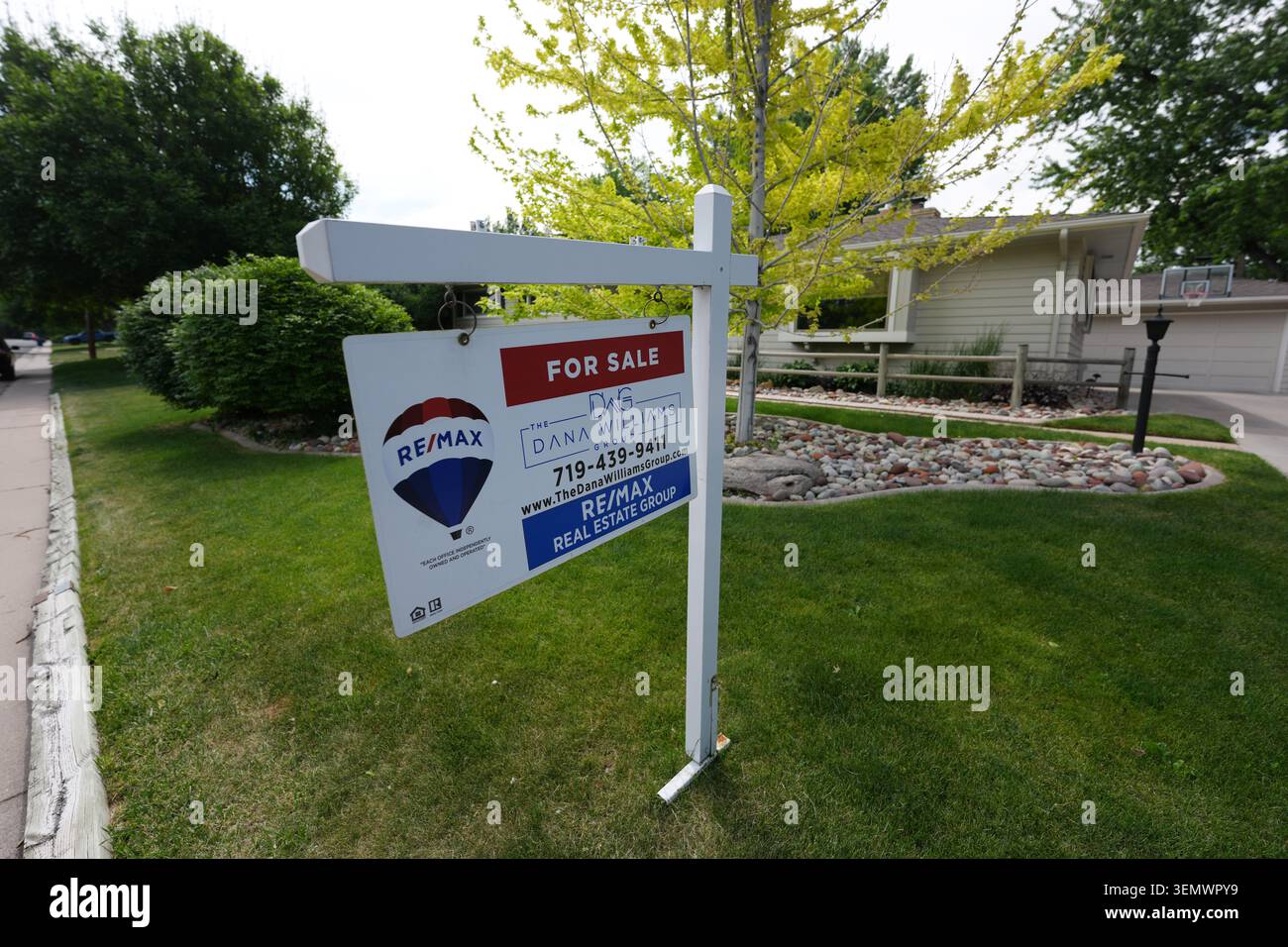 A sign stands outside a single-family residence on the market Monday ...
