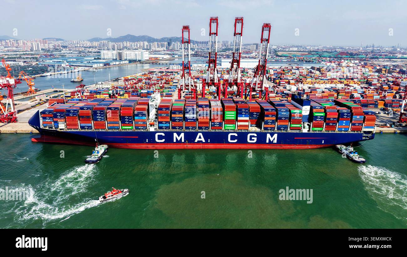 A cargo ship loaded with foreign trade containers docks at a berth in ...