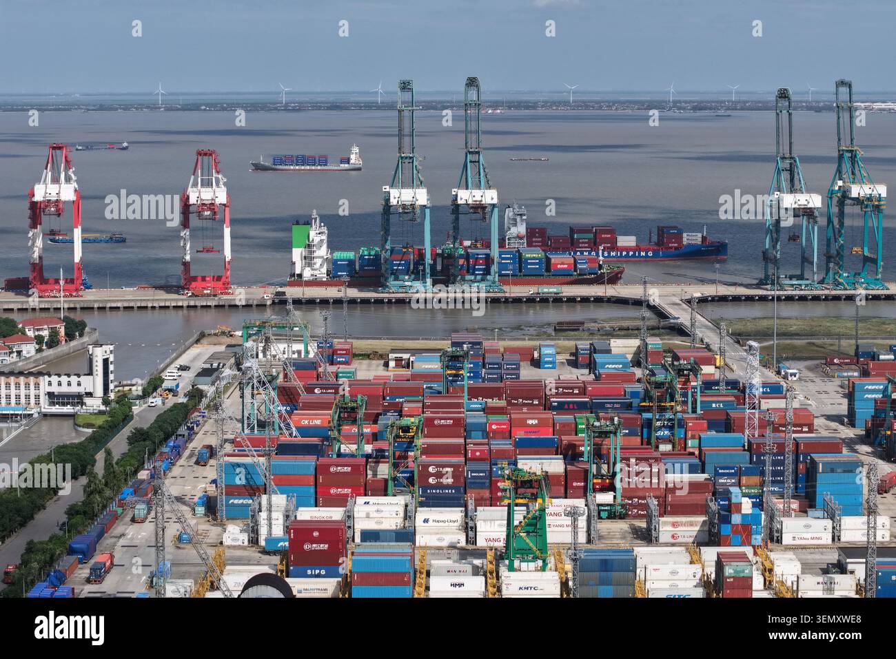 Containers are handled at a busy foreign trade terminal in Shanghai ...