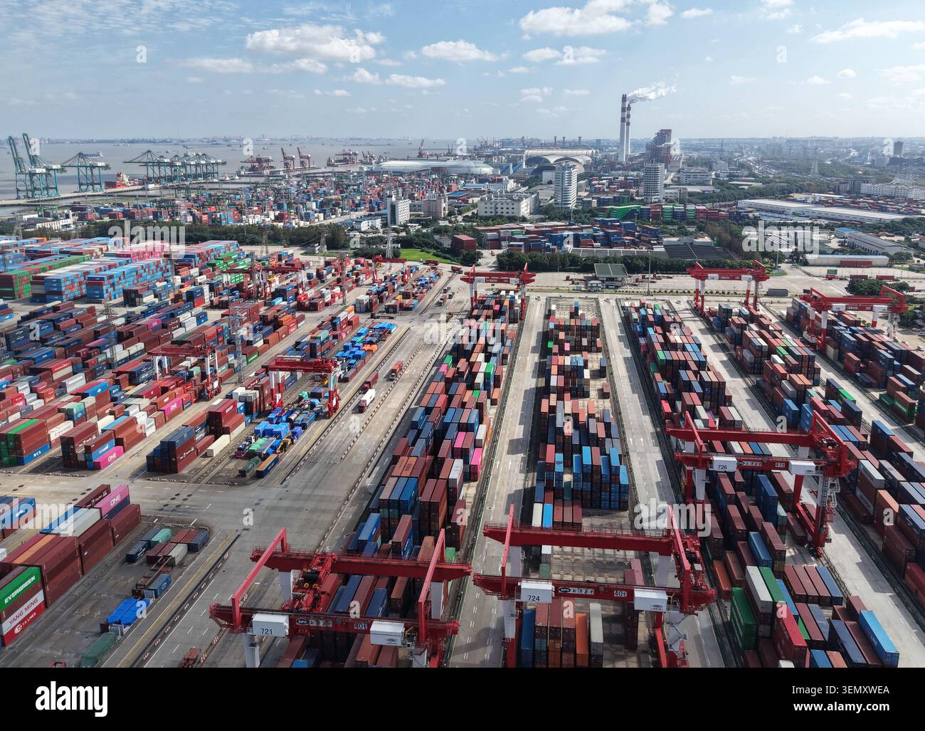 Containers are handled at a busy foreign trade terminal in Shanghai ...