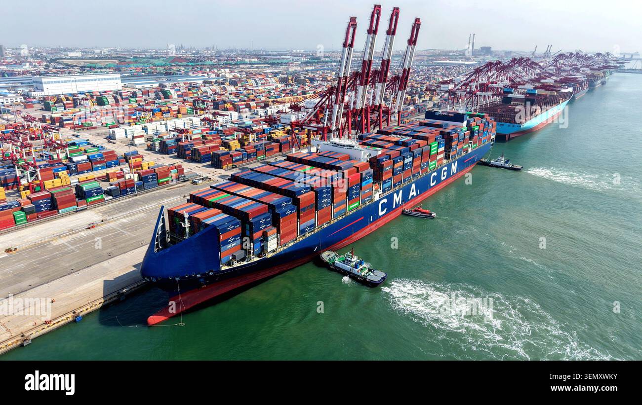A cargo ship loaded with foreign trade containers docks at a berth in ...