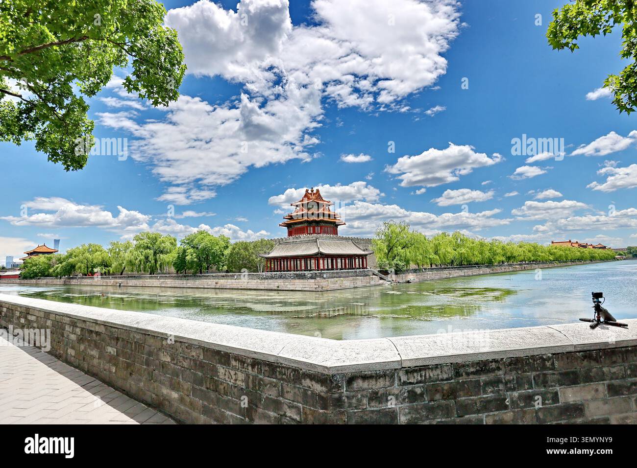 Tourists take photos of the Forbidden City's corner tower against clear ...