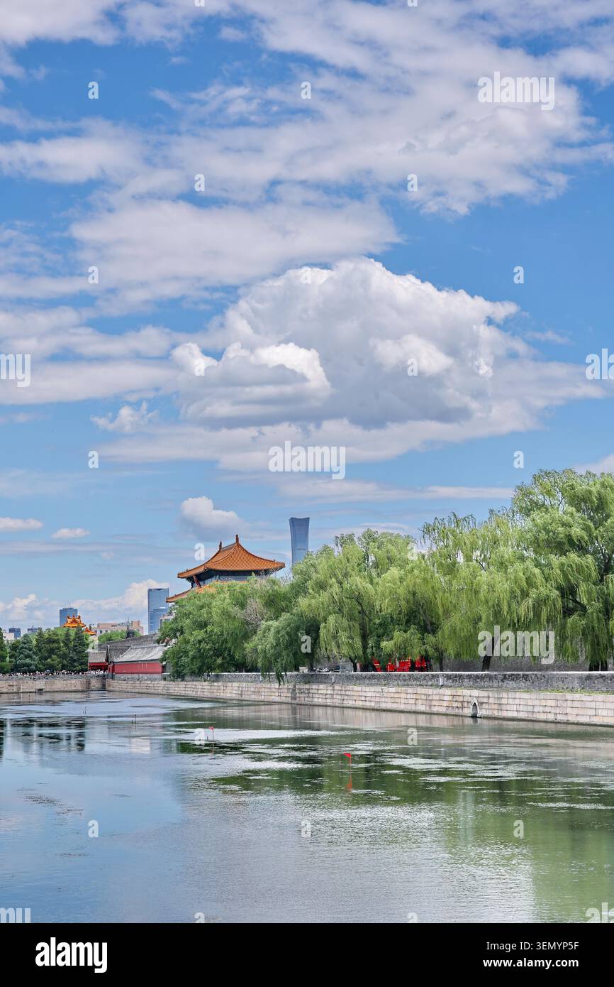 Tourists take photos of the Forbidden City's corner tower against clear ...