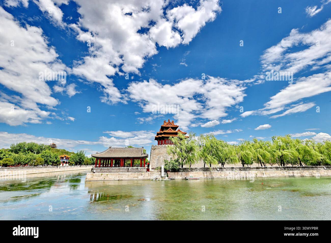 Tourists take photos of the Forbidden City's corner tower against clear ...