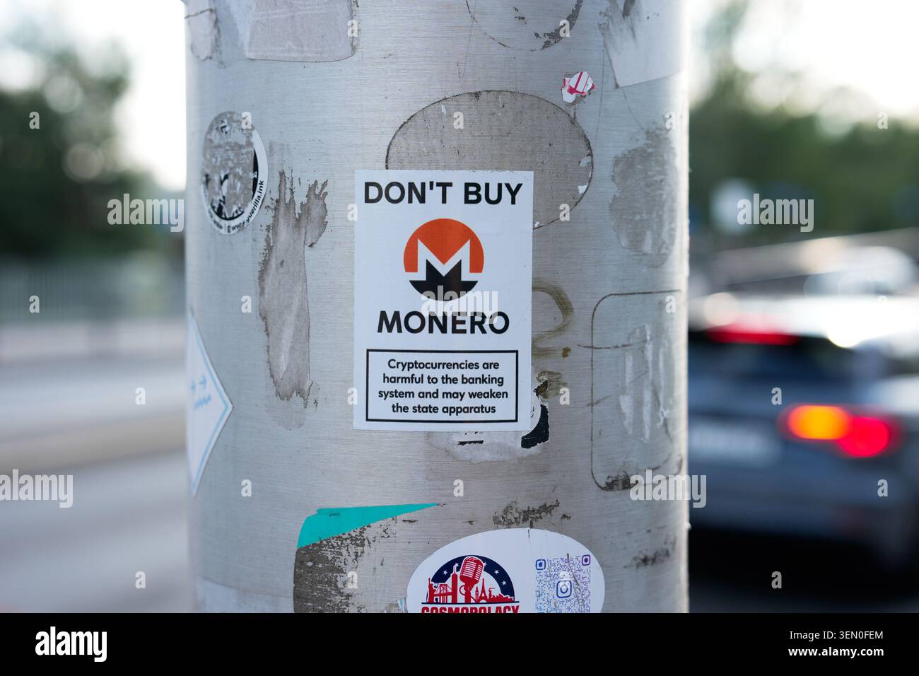 A sticker advertising Monerao crypto currency is seen on a lantern pole ...