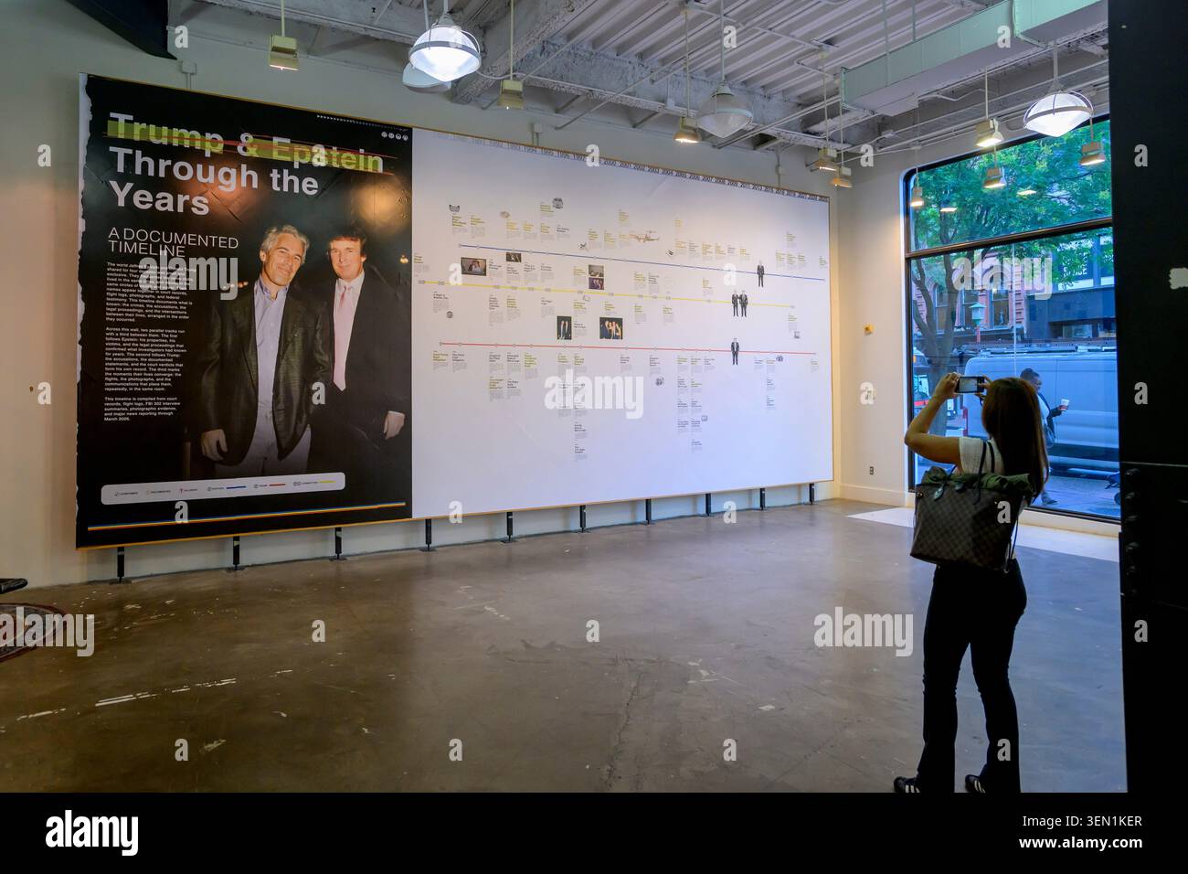 A woman views exhibits of The Donald J. Trump and Jeffrey Epstein ...