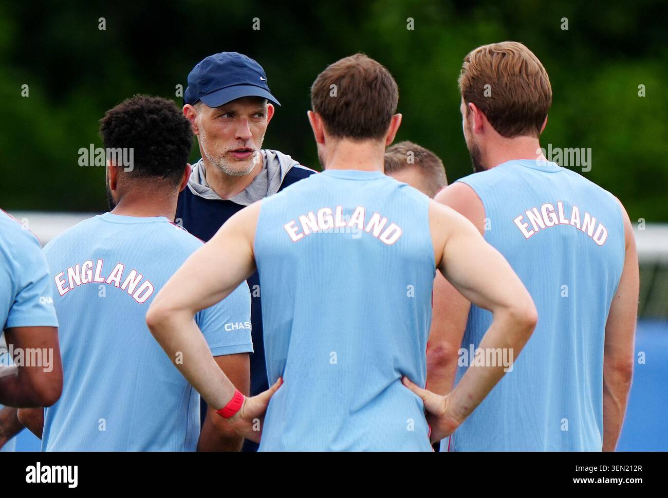 England head coach Thomas Tuchel speaks to players during a training ...